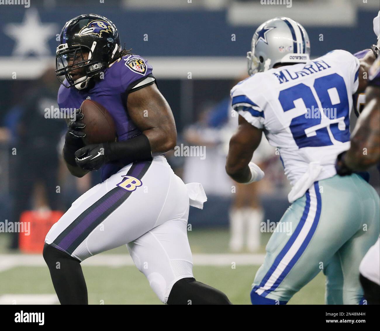 Baltimore Ravens outside linebacker Courtney Upshaw, left, runs to the ...