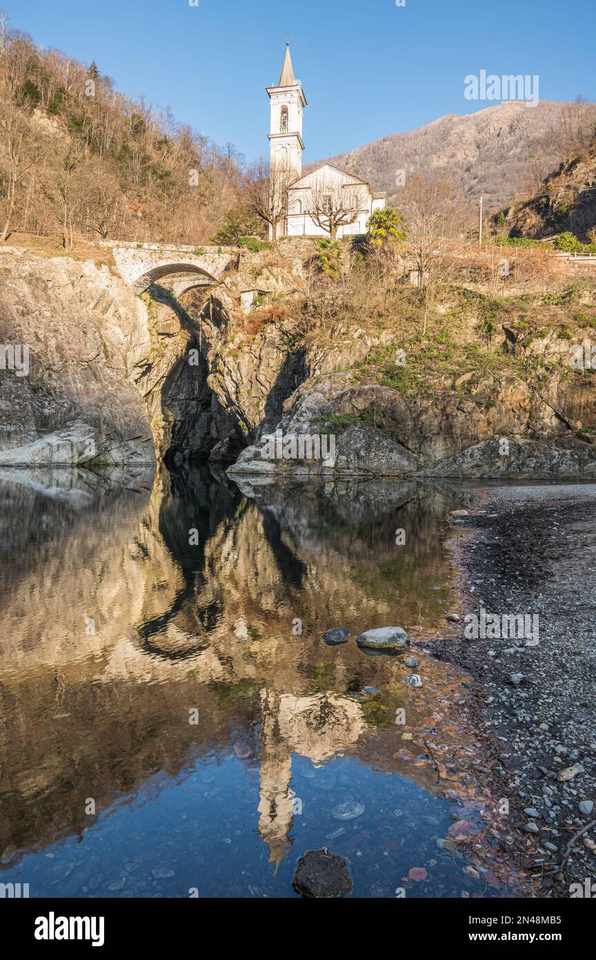 The beautiful ravine of Sant'Anna with the church reflected in the ...