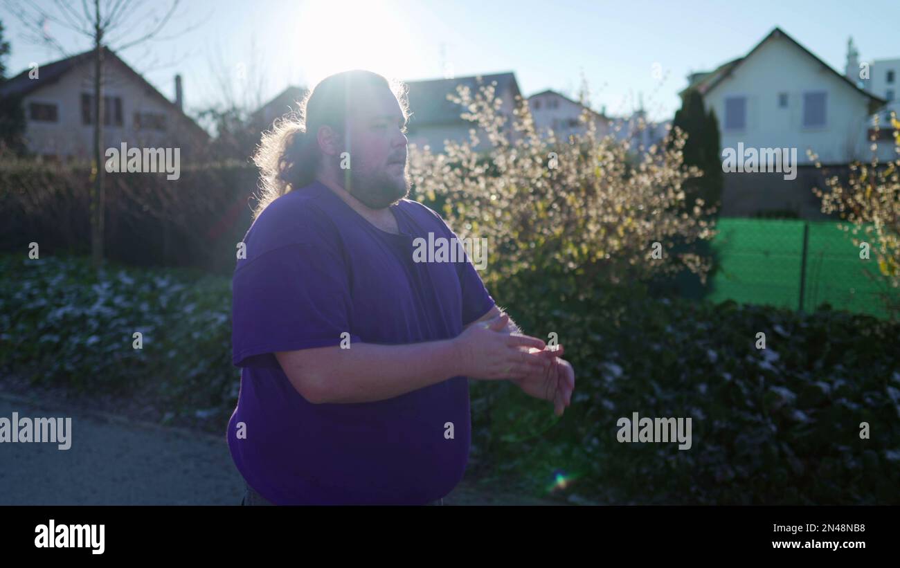 One overweight man starts to run outside getting back to into shape ...