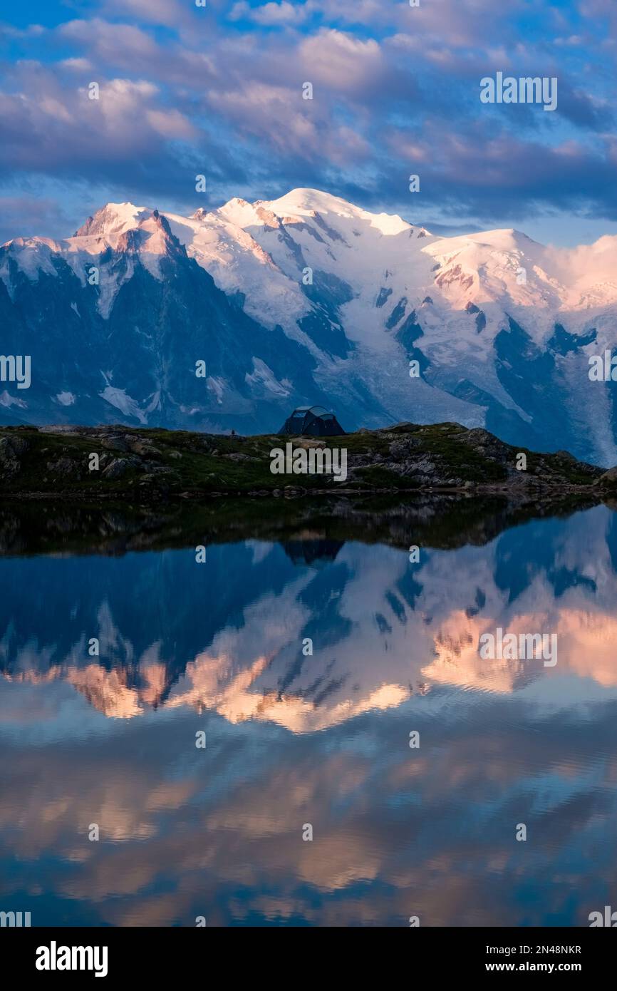 The peaks of the Mont Blanc massif and some clouds, reflecting on the ...
