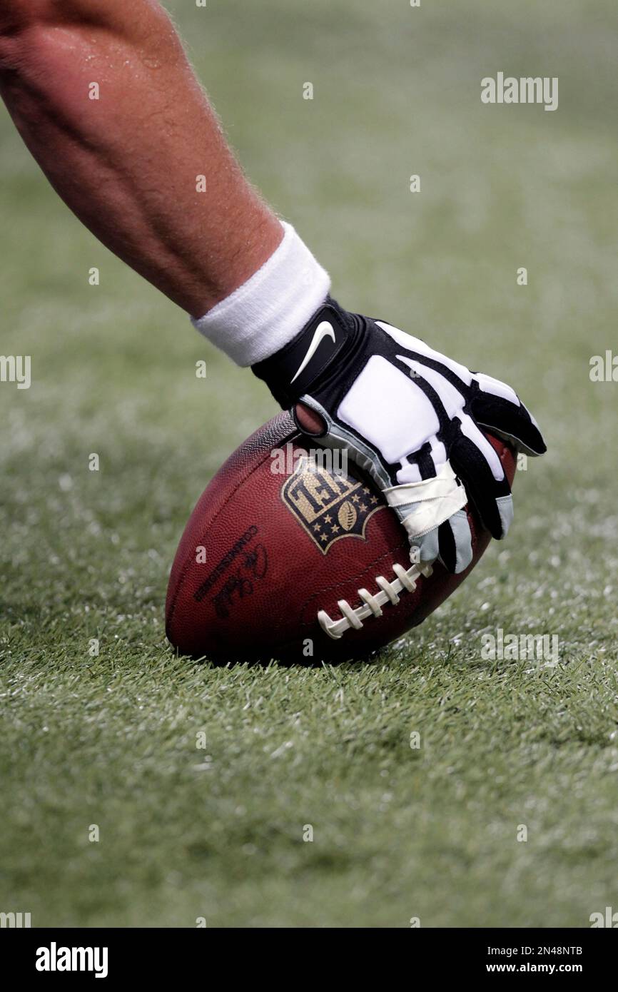 A center prepares to hike the ball before the start of an NFL preseason ...
