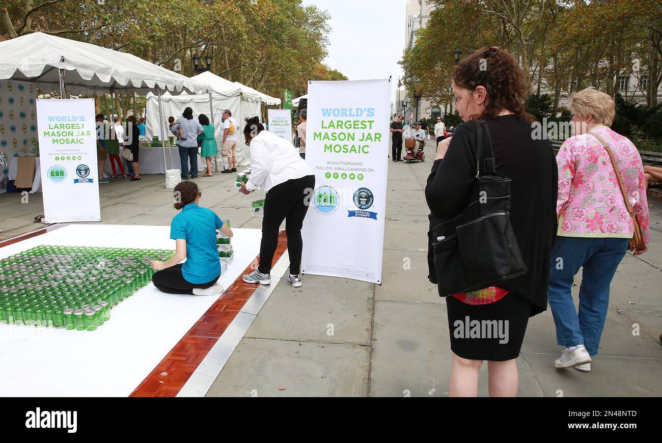 People look on as Jarden Home Brands attempts to set the Guinness World ...