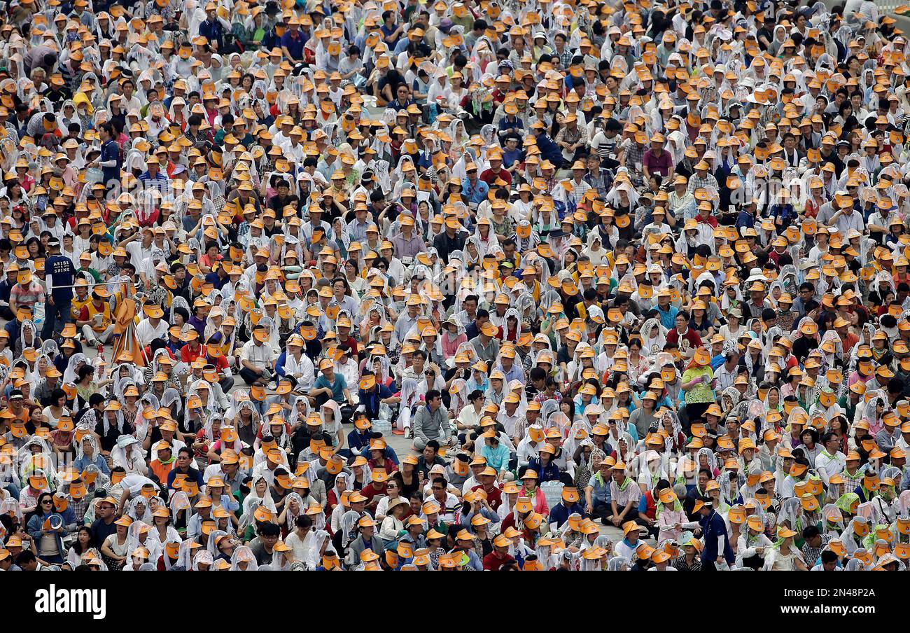 A crowd of the Catholic faithful gather during a mass and the ...