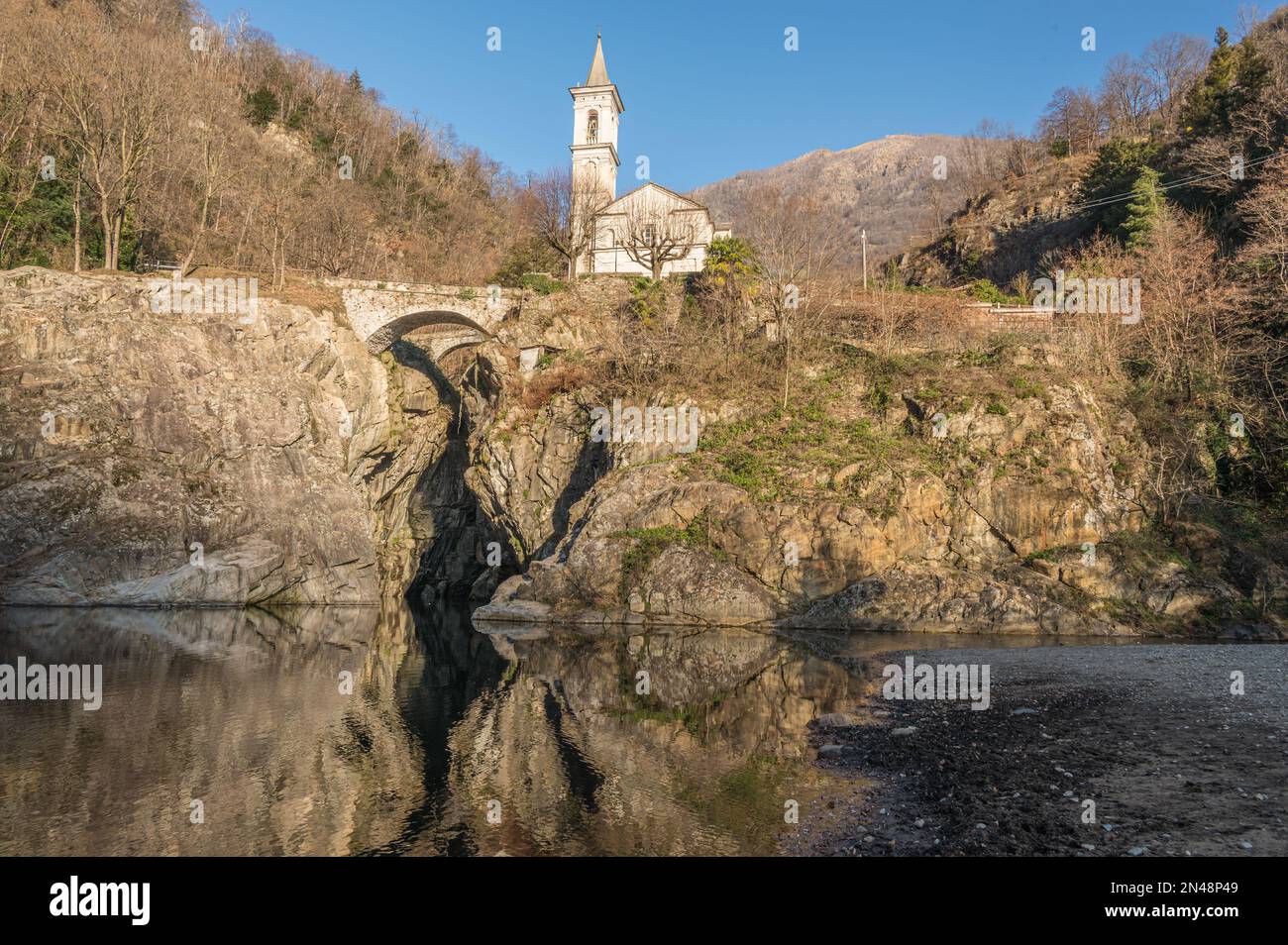 The beautiful ravine of Sant'Anna with the church reflected in the ...
