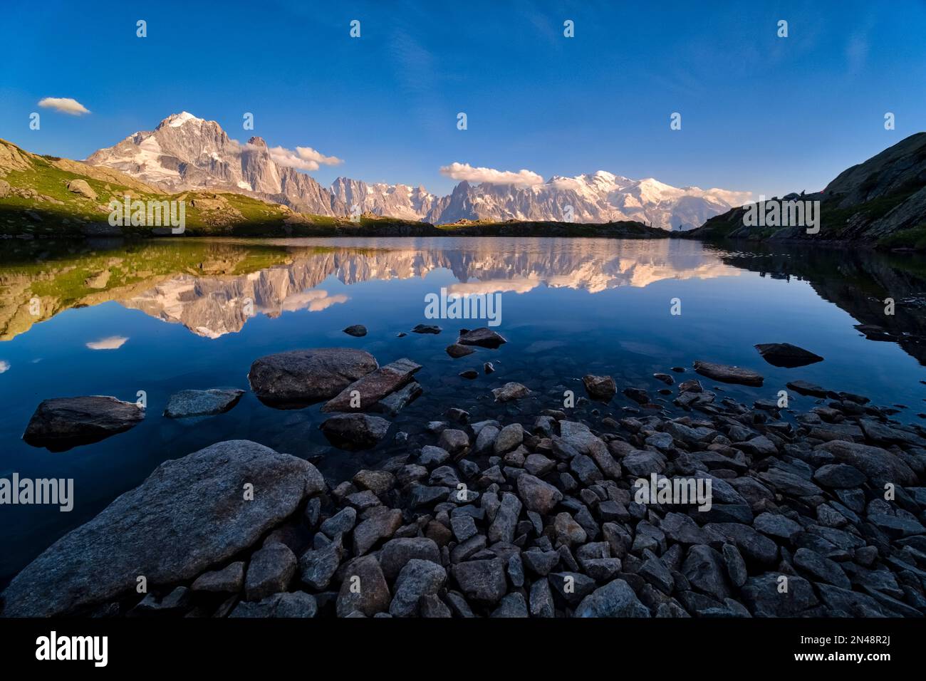The peaks of the Mont Blanc massif, reflecting on the surface of Lacs des Chéserys Stock Photo ...