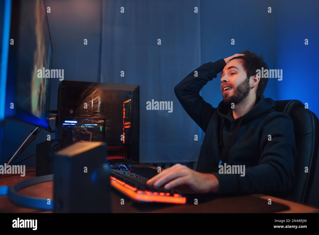 Cyber sportsman plays computer hi-res stock photography and images - Alamy