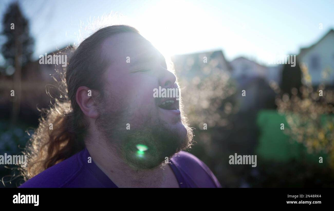 One overweight man taking a deep breath after run recovering from ...
