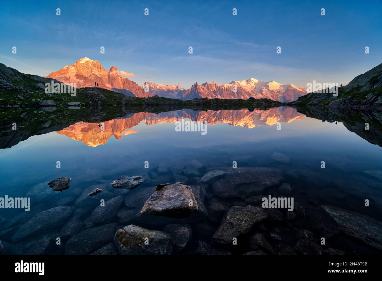 The peaks of the Mont Blanc massif are reflecting in the Lacs des ...