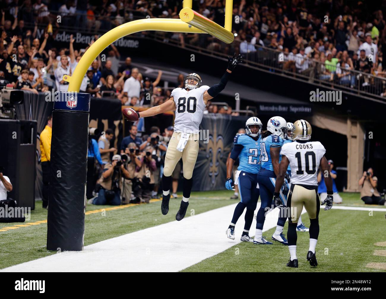 New Orleans Saints tight end Jimmy Graham (80) slam dunks after his ...