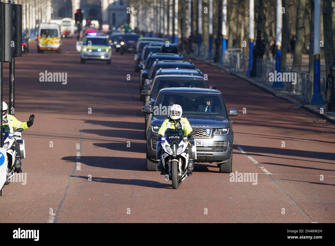 A motorcade carrying Ukrainian President Volodymyr Zelensky travels ...