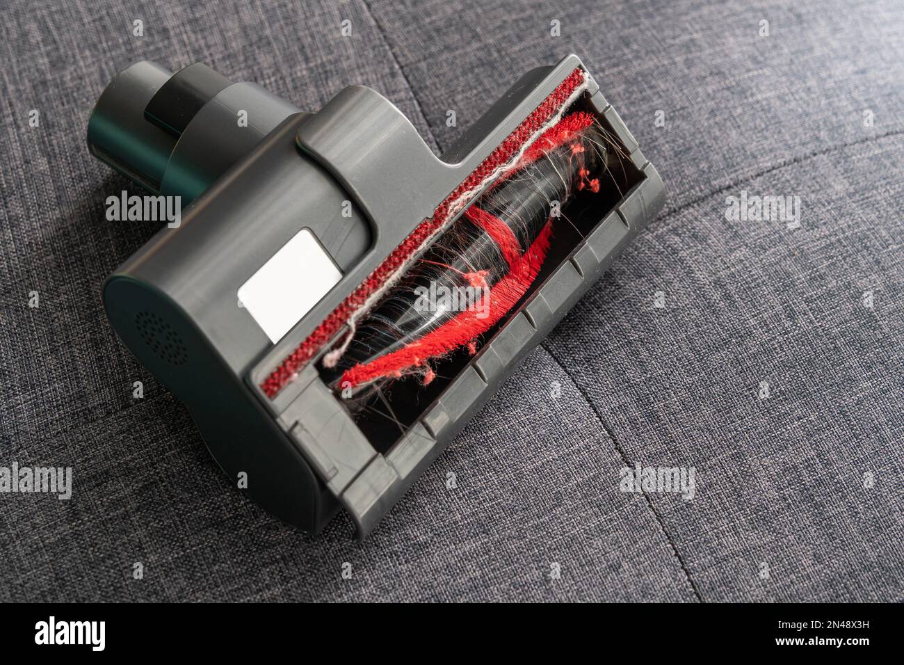 Close-up view of the hair and string stuck on the dust mite vacuum ...