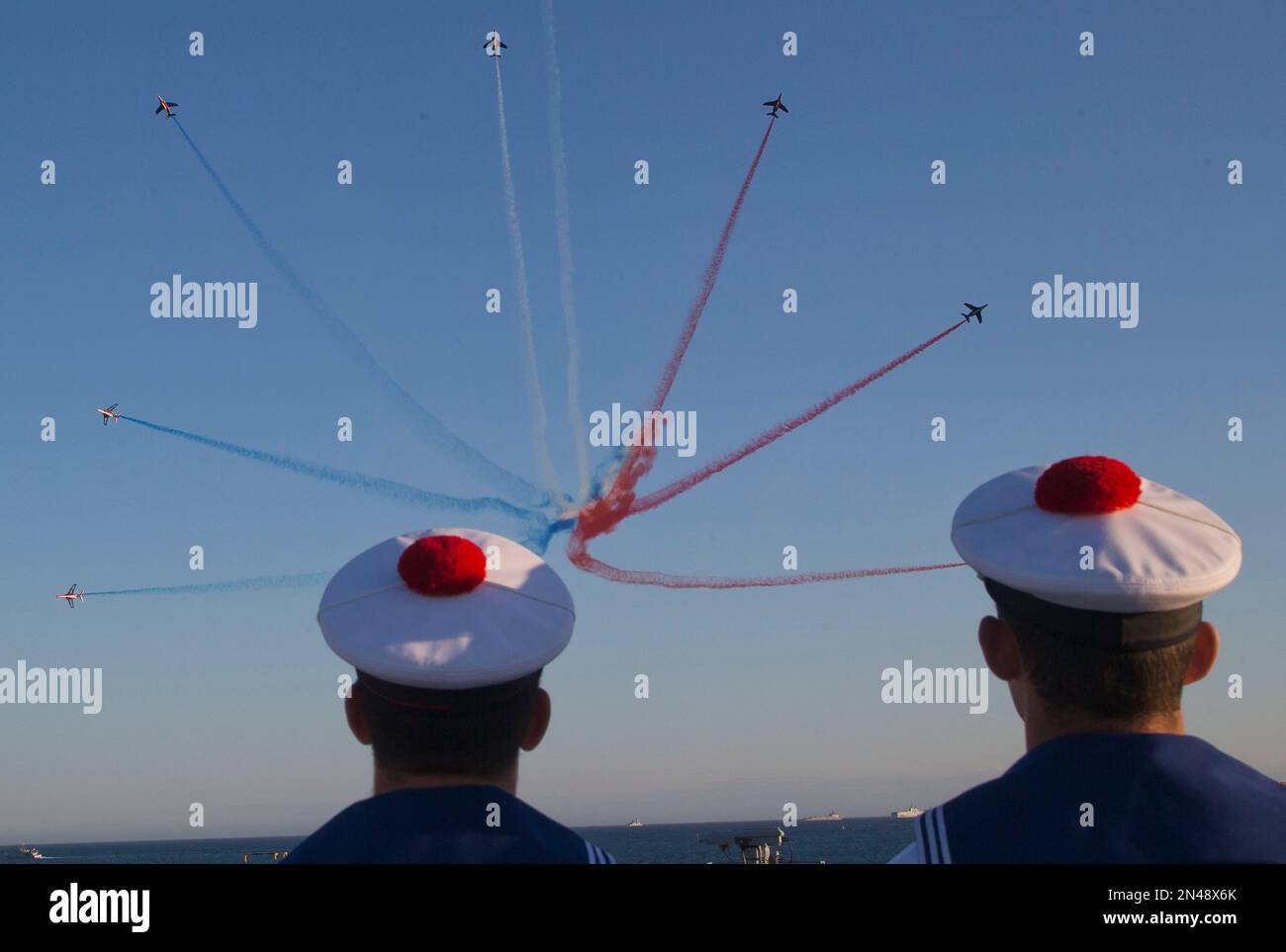 Navy soldier watch the Patrouille de France aerial display team ...