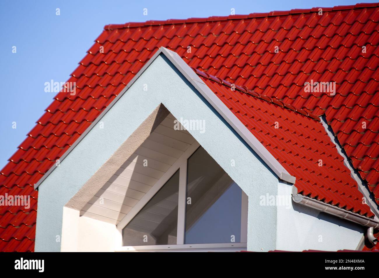 Beautiful red tiled roof with large dormer window Stock Photo - Alamy