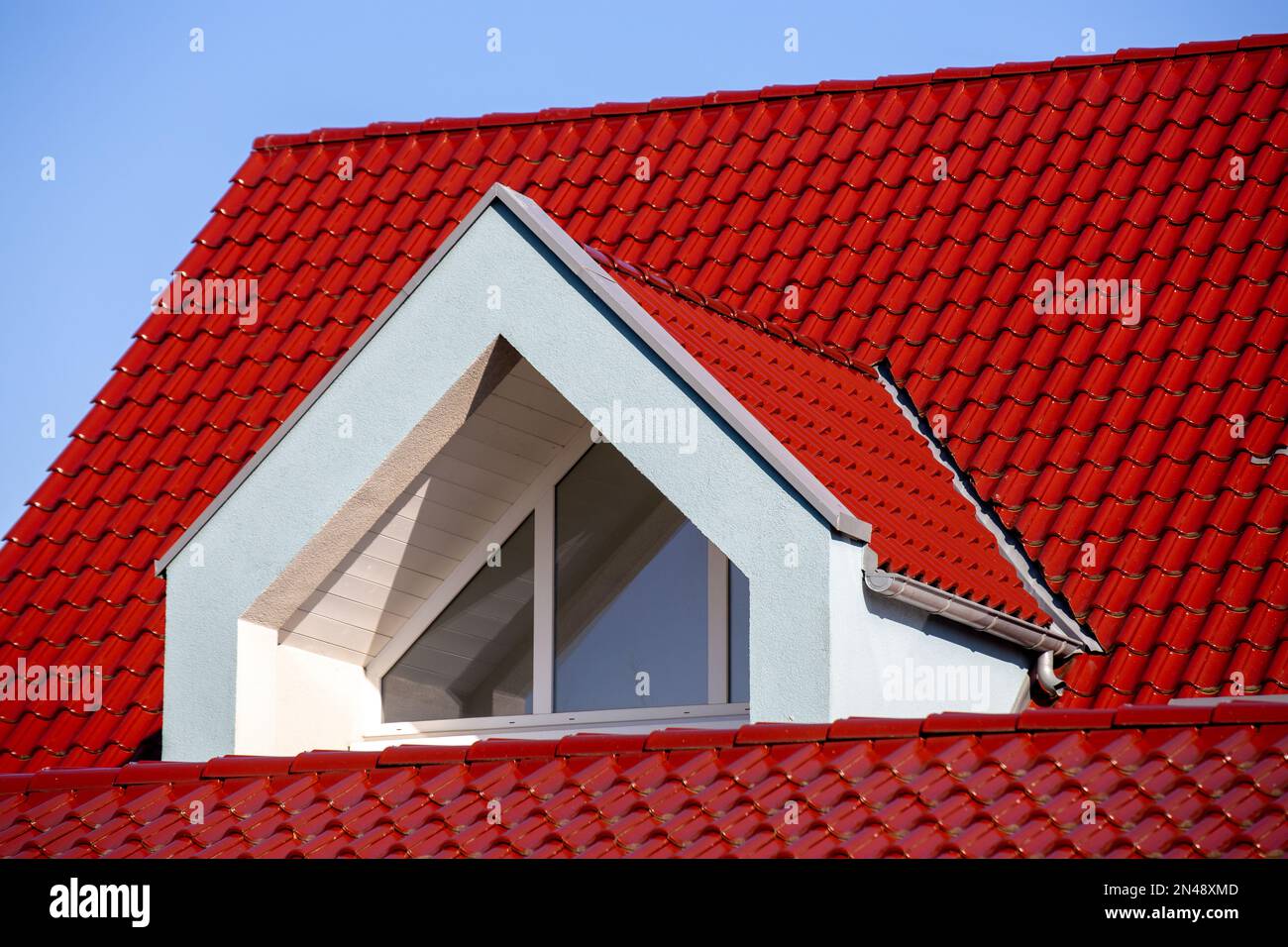 Beautiful red tiled roof with large dormer window Stock Photo - Alamy