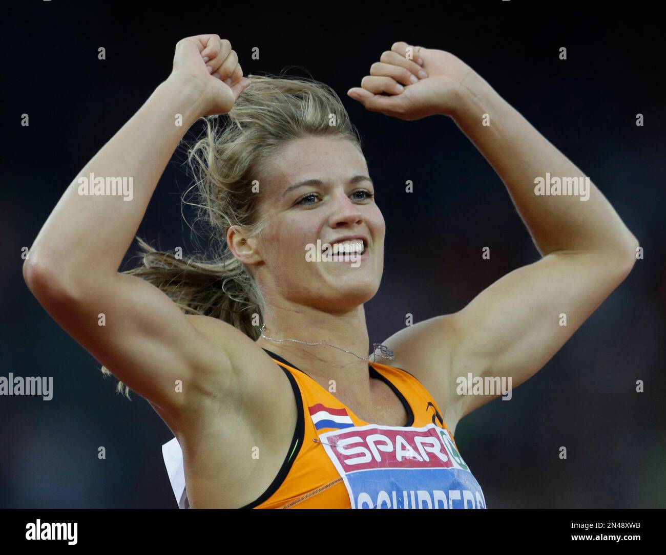 Netherlands' Dafne Schippers crosses the finish line to win the 200m ...