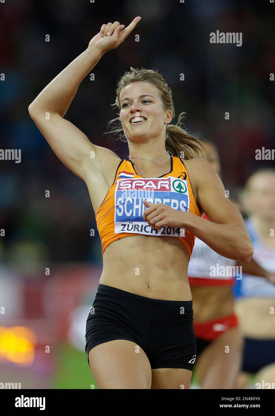 Netherlands' Dafne Schippers crosses the finish line to win the 200m ...