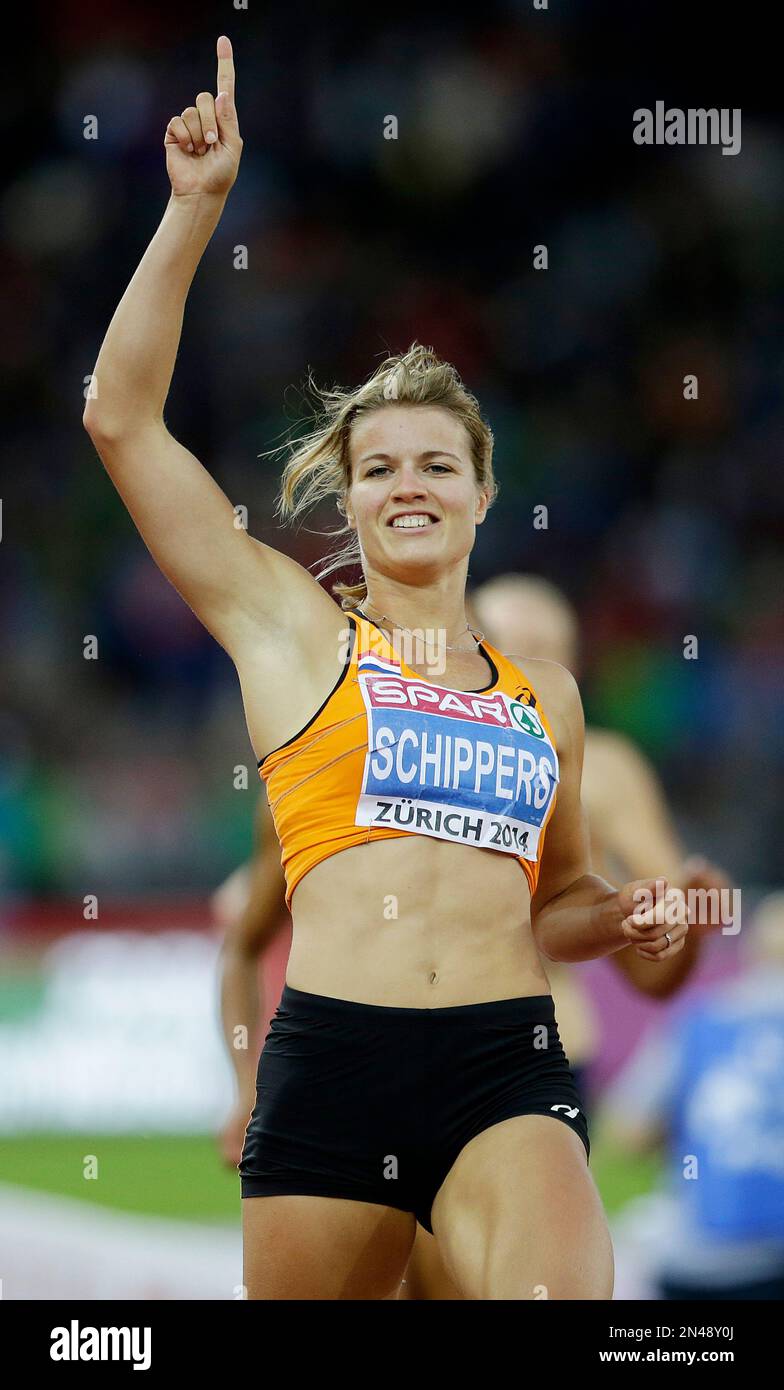 Netherlands' Dafne Schippers crosses the finish line to win the 200m ...