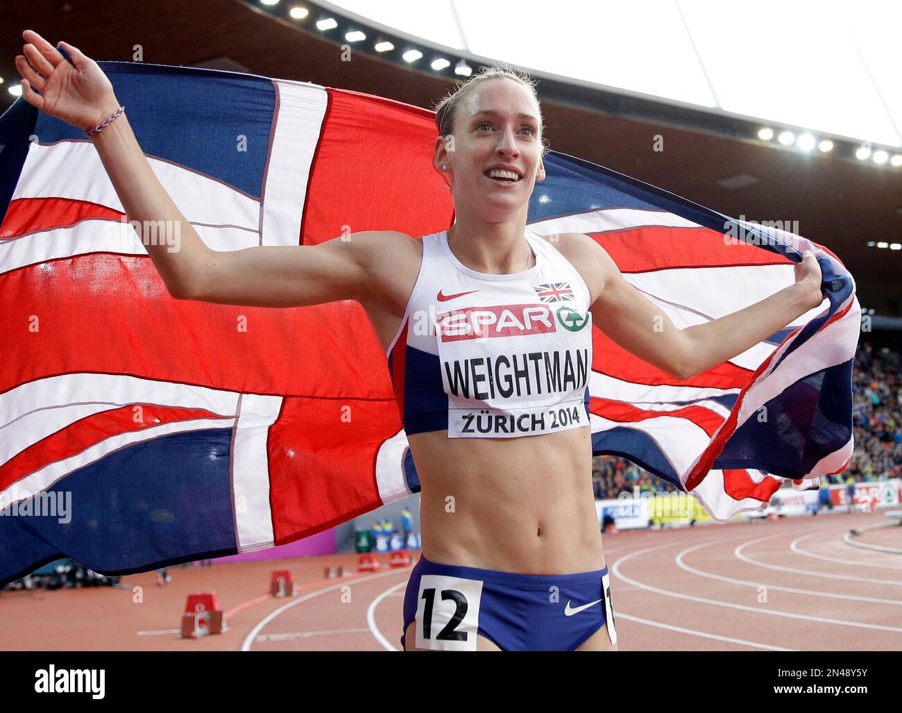 Britain's Laura Weightman celebrates with her country's flag after ...