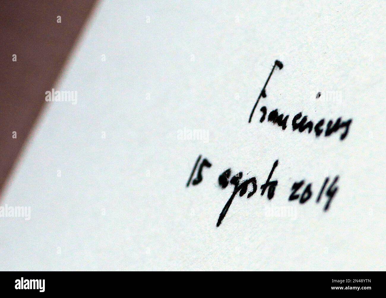 The signature of Pope Francis is seen on the guest book after he prayed ...