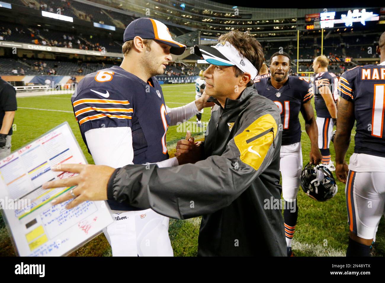 Chicago Bears quarterback Jay Cutler (6) talks with Jacksonville ...