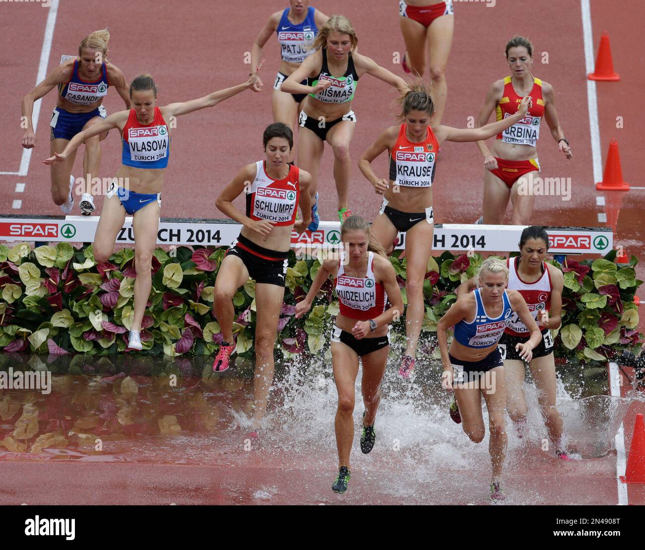 Athletes run in the women's 3000m steeplechase heat during the European ...