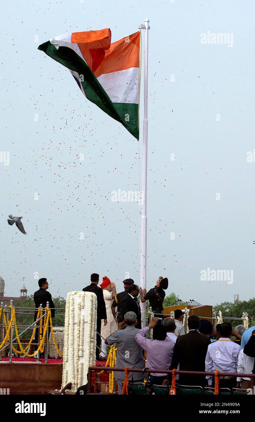 Indian Prime Minister Narendra Modi salutes after unfurling the ...