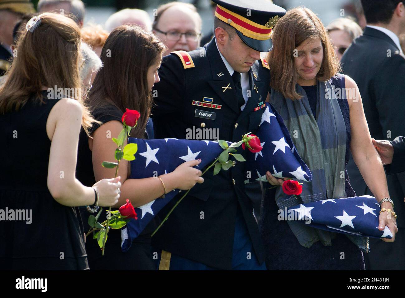 Retired Col. Susan Myers, right, is comforted by her children, 1st Lt ...