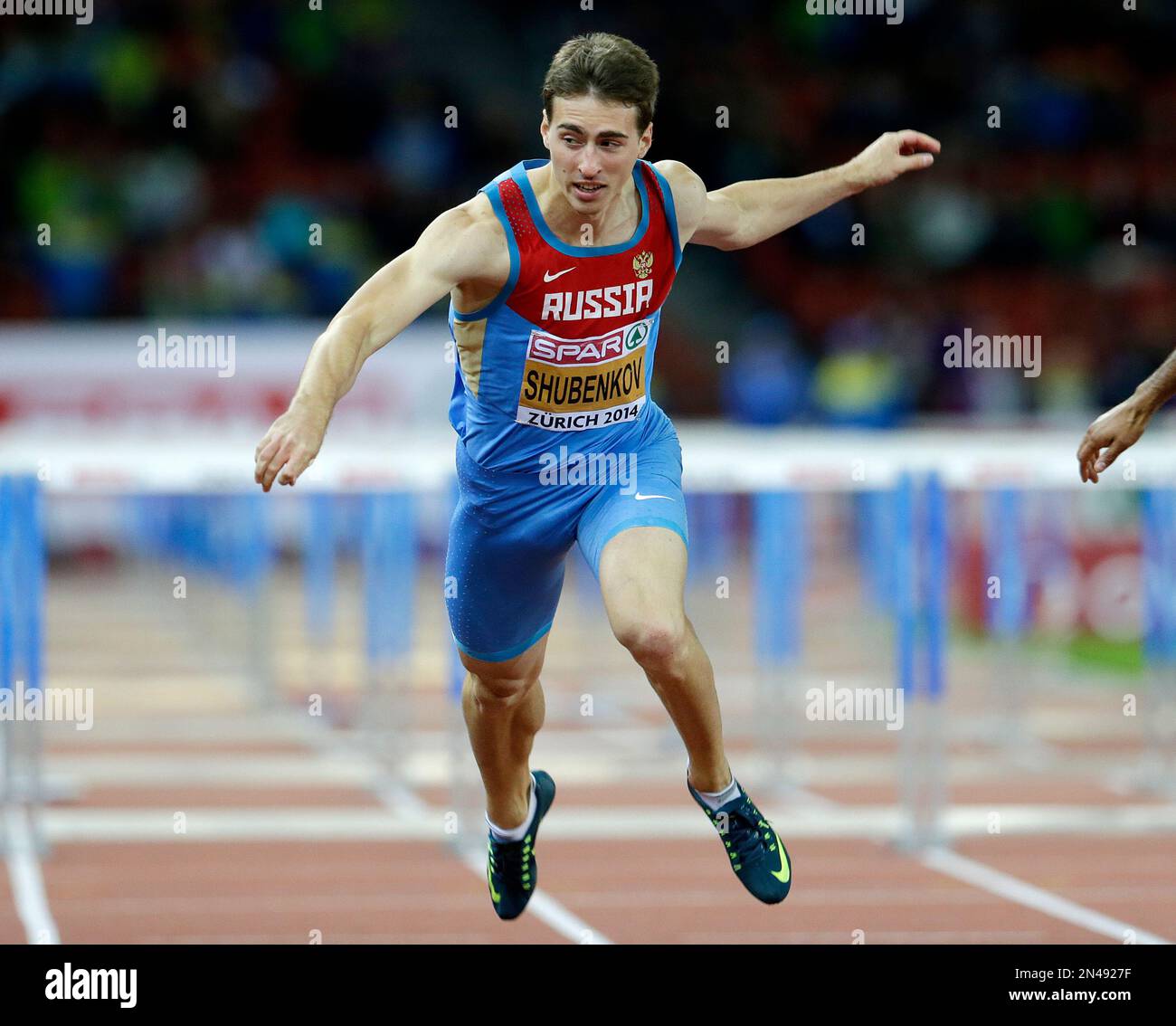 Russia's Sergey Shubenkov crosses the finish line to win the 110m ...