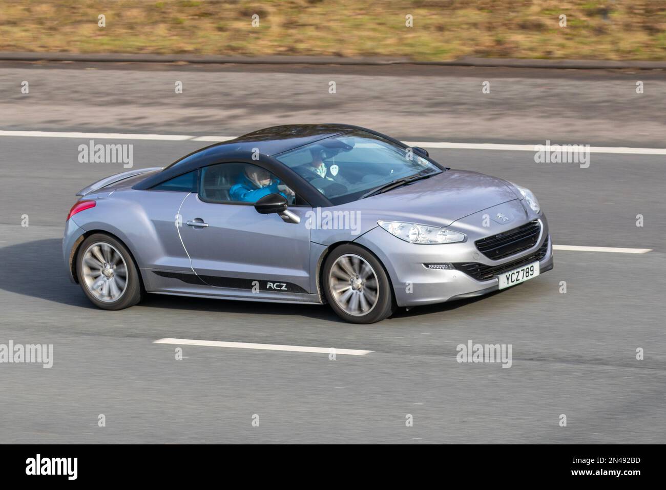 2014 Grey PEUGEOT RCZ THP RED CARBON 1598cc. Petrol 6 speed manual; travelling on the M61 ...