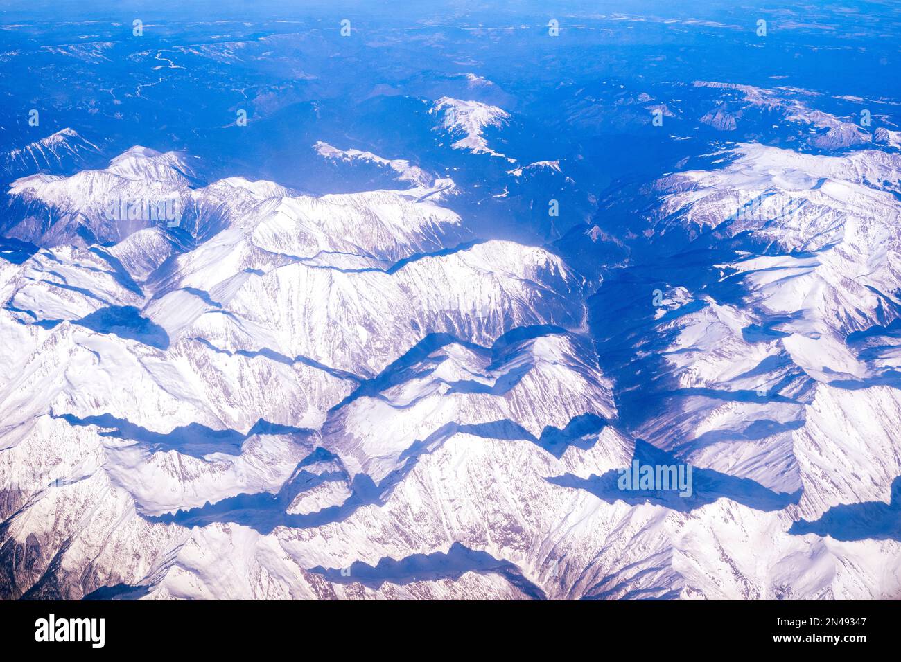 Aerial flying above snowy mountains hi-res stock photography and images - Alamy