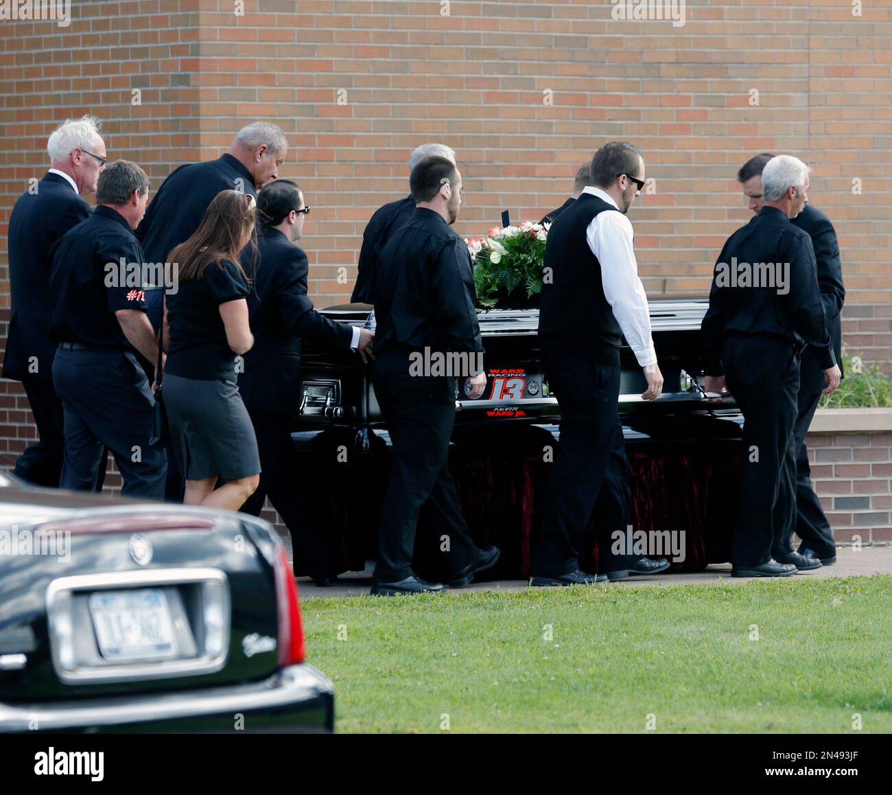 The casket of race car driver Kevin Ward Jr., is taken into South Lewis ...