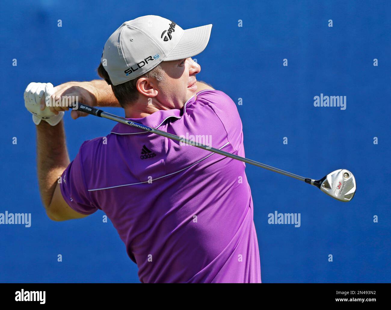 Martin Laird watches his tee shot on the 10th hole during the first ...