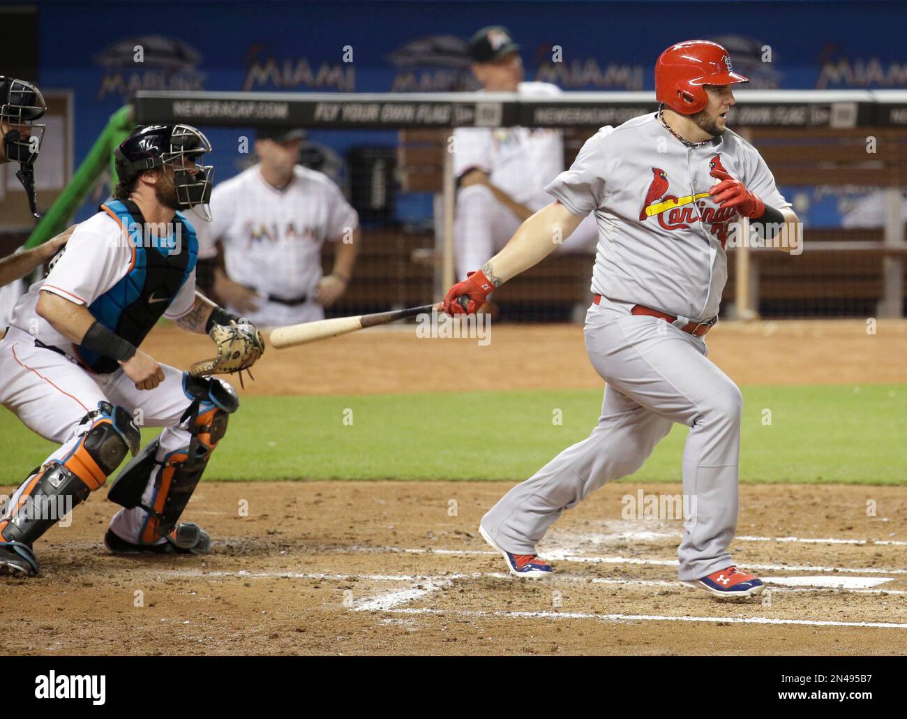 St. Louis Cardinals' Matt Adams, right,watches after after hitting a ...
