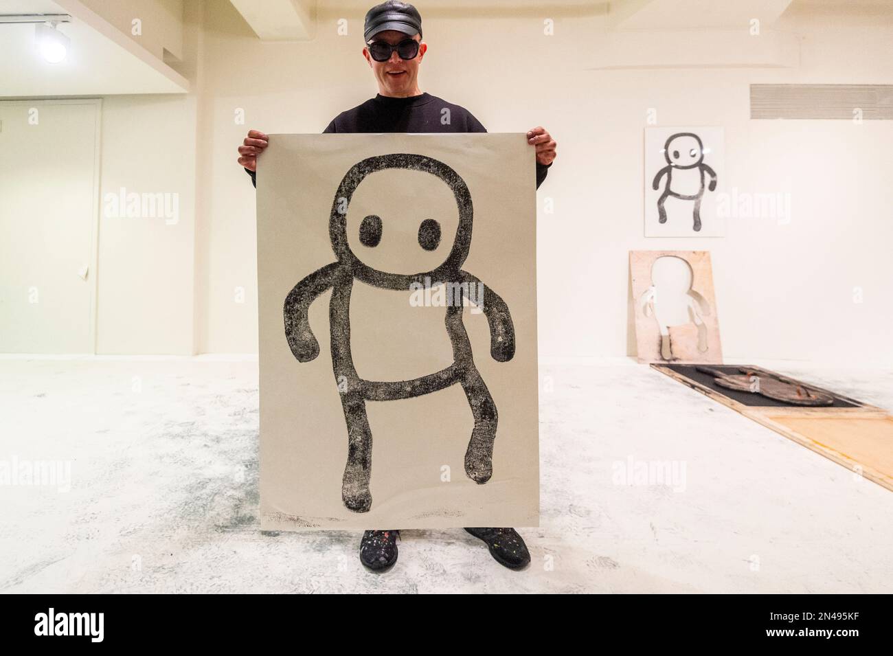 London, UK. 8 February 2023. Street artist STIK shows how to create a ...