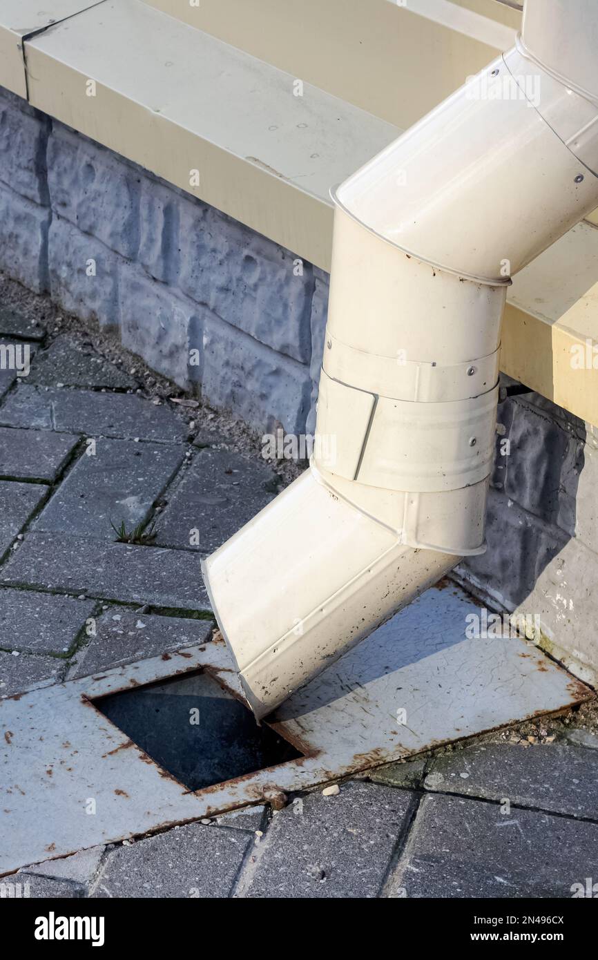 Rainwater drainage system on the sidewalk close up Stock Photo - Alamy