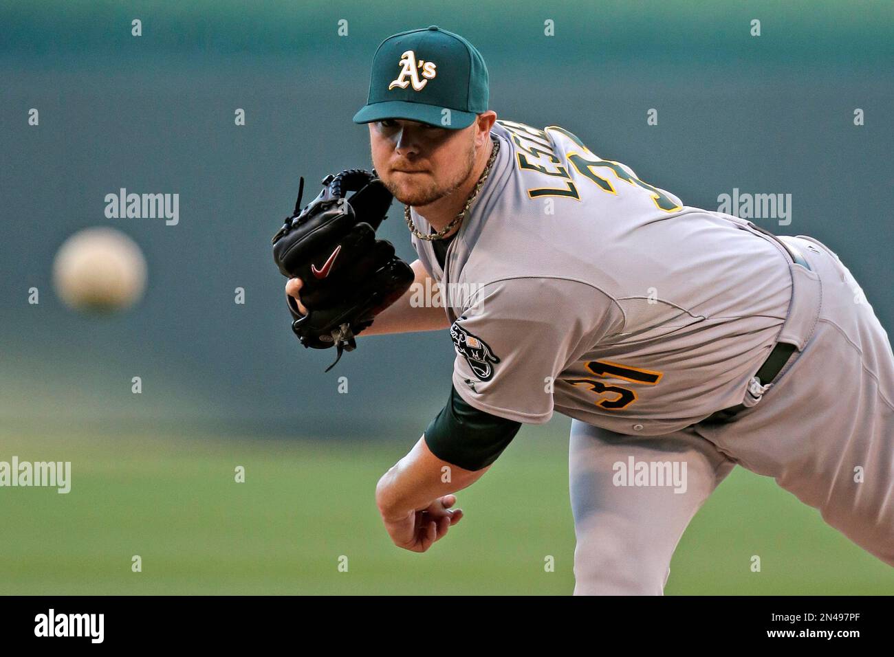 Oakland Athletics starting pitcher Jon Lester throws during the first ...