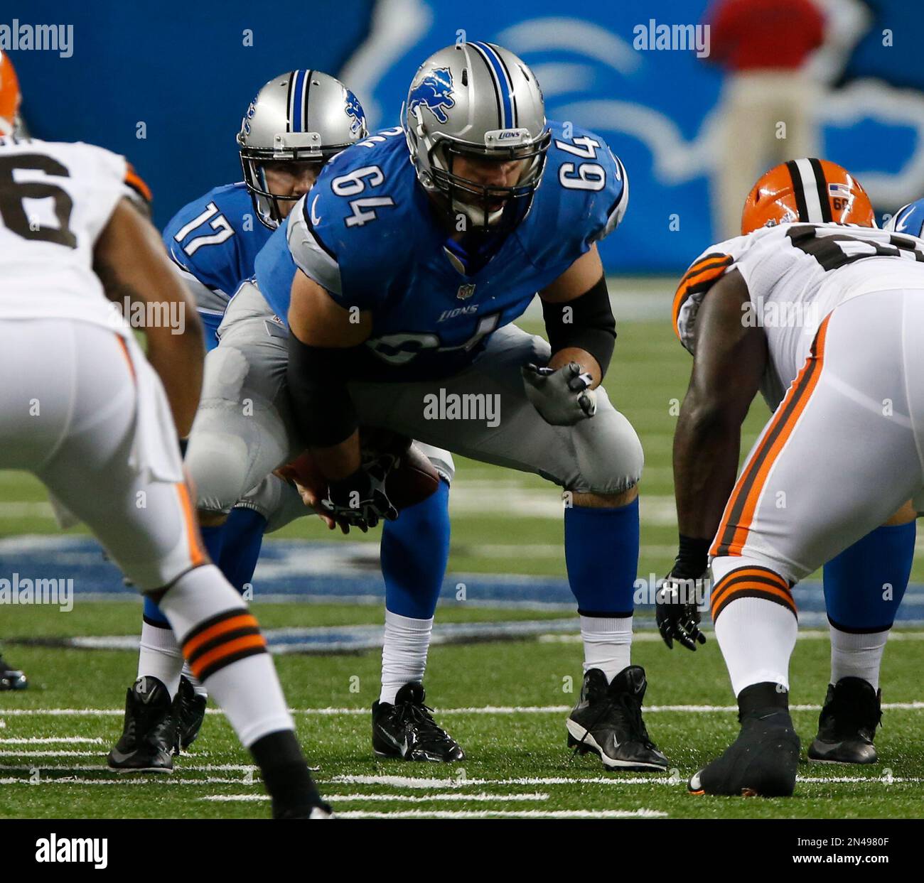 Detroit Lions center Travis Swanson (64) hikes the ball to quarterback ...