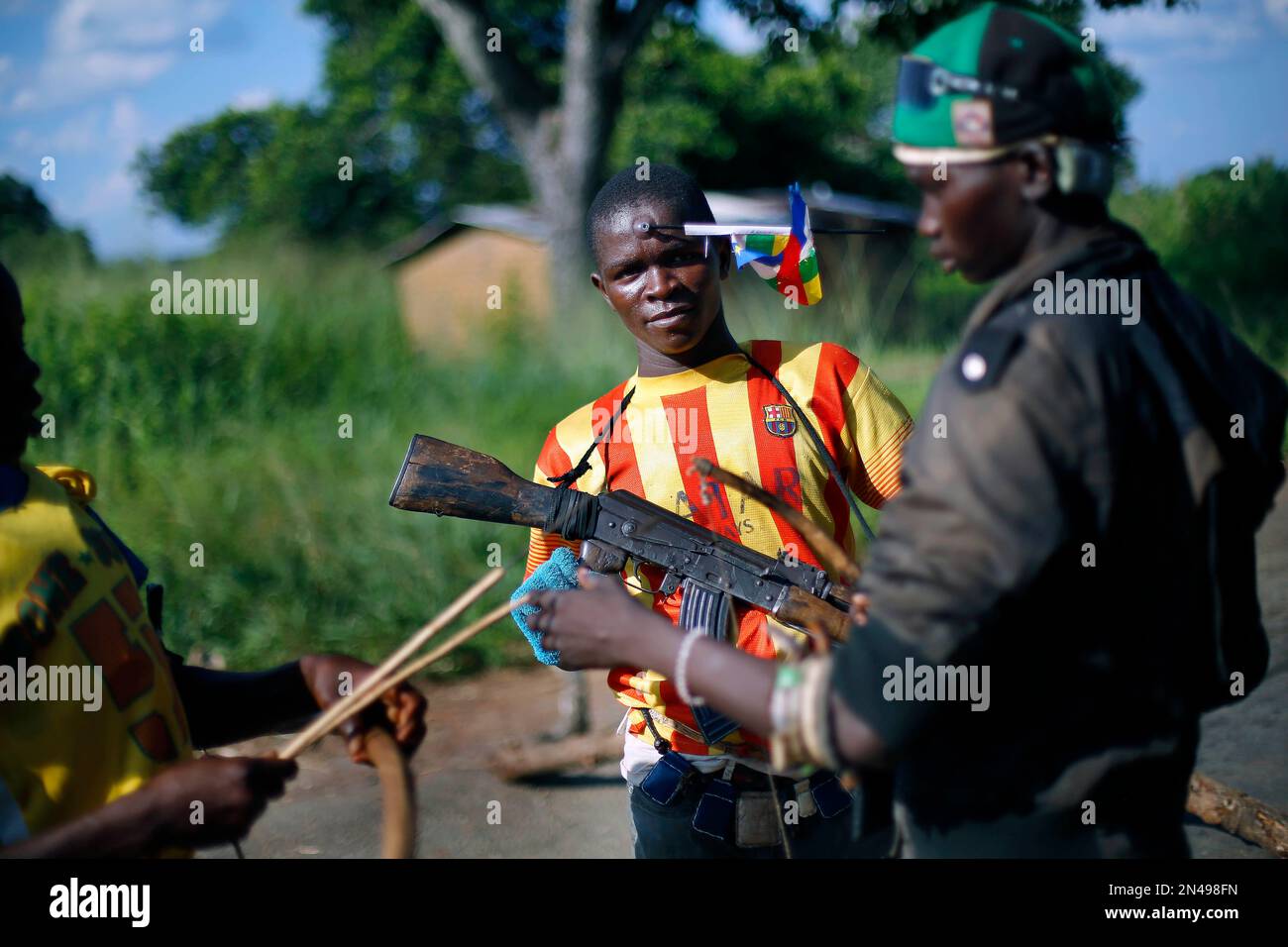 Armed anti-balaka militiamen man a checkpoint some 60 kms north of ...
