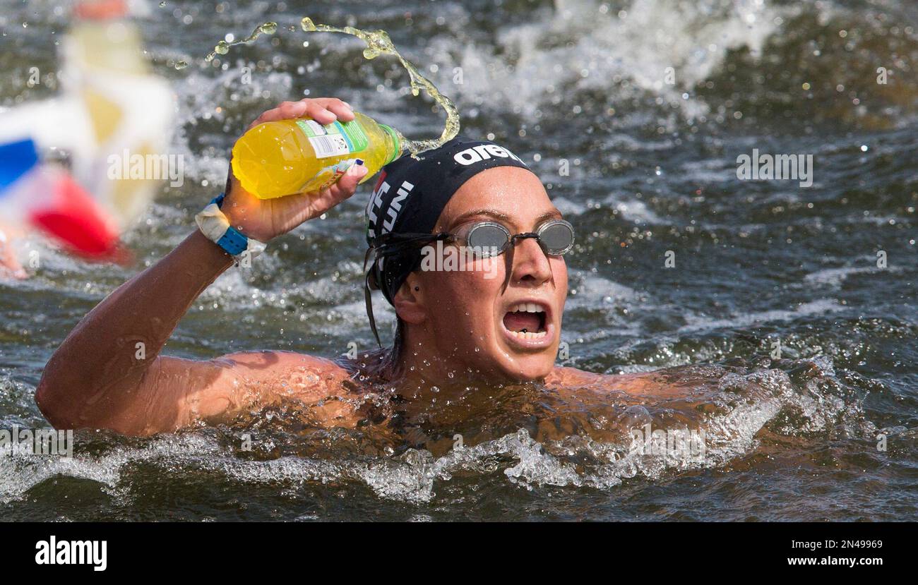 Rachele Bruni of Italy grabs a drink in the feeding zone during the ...