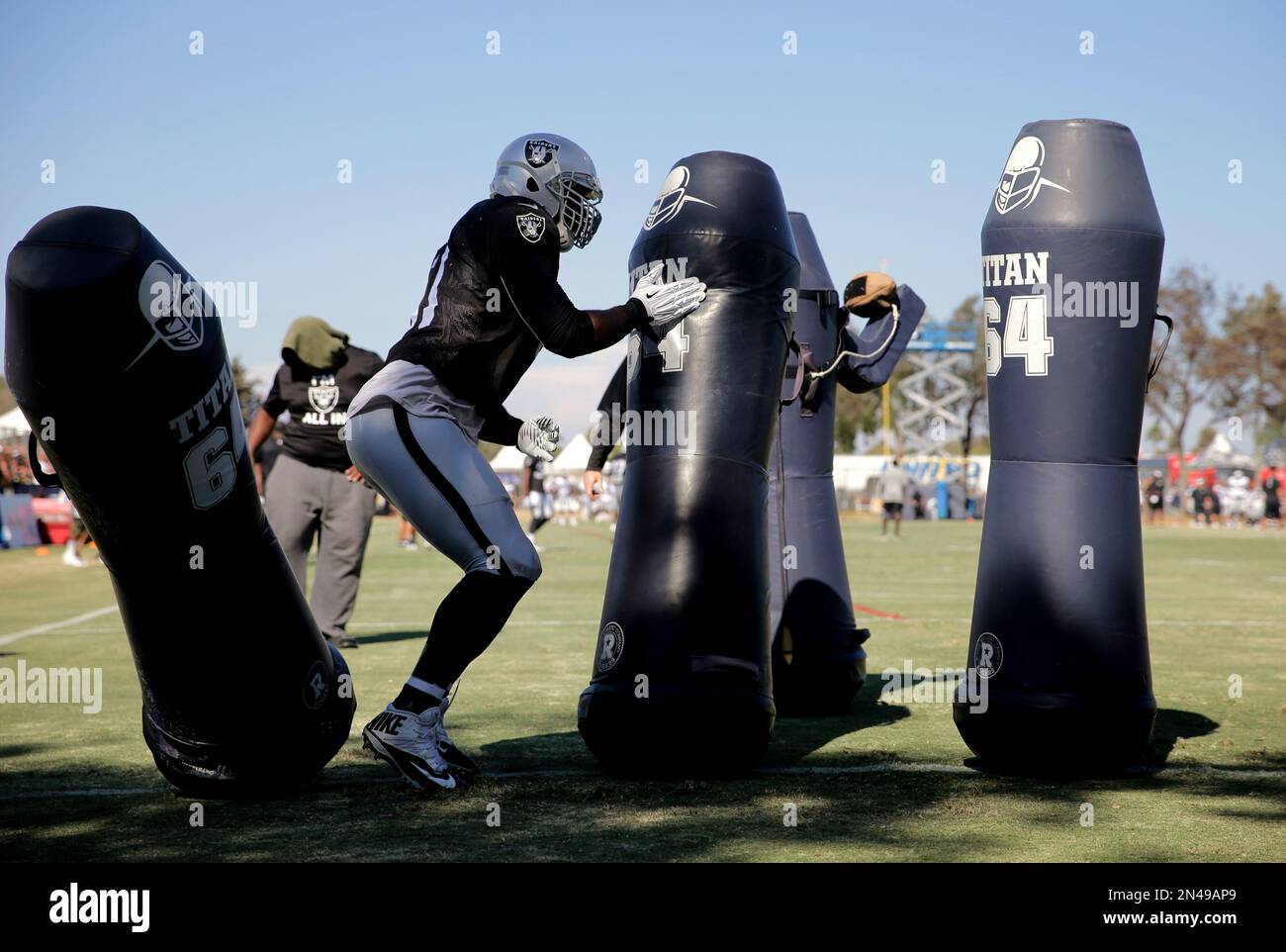 Oakland Raiders defensive end Justin Tuck runs a drill during a joint ...