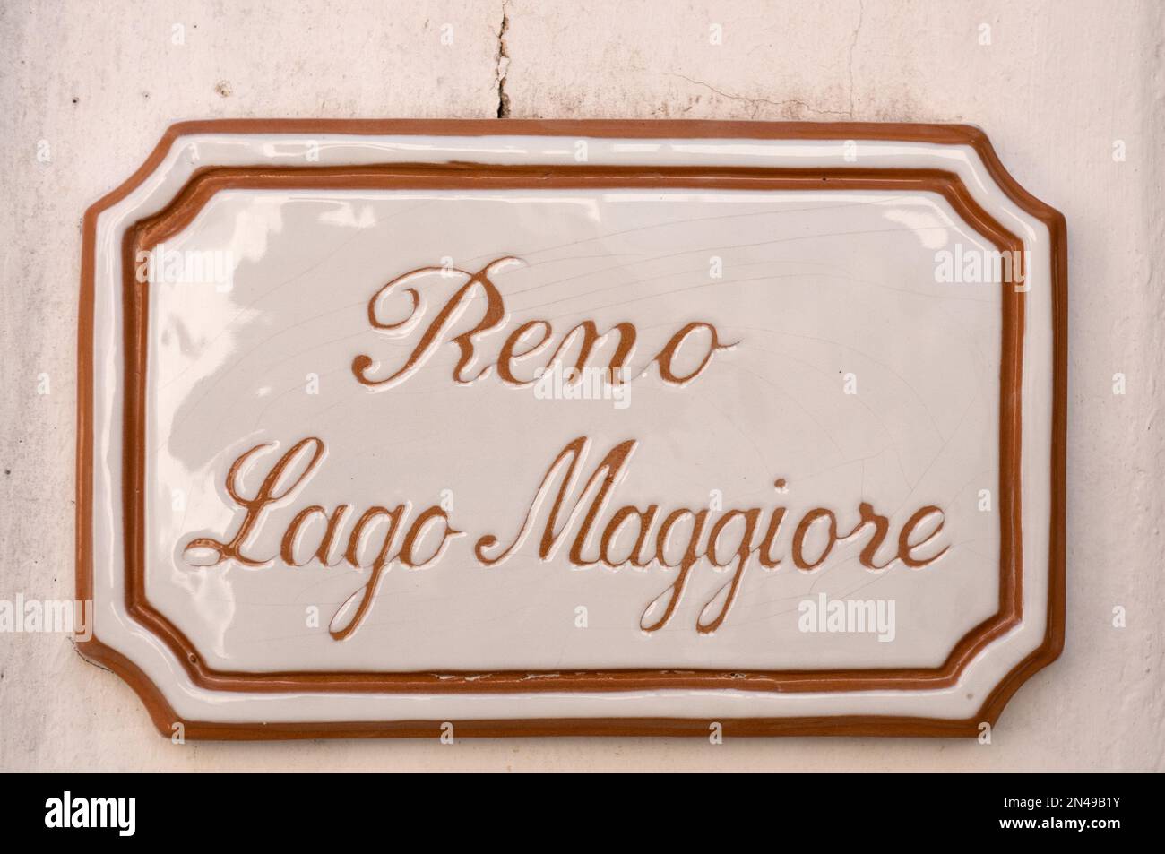 A white Reno Lago-Maggiore board isolated with golden edges Stock Photo ...