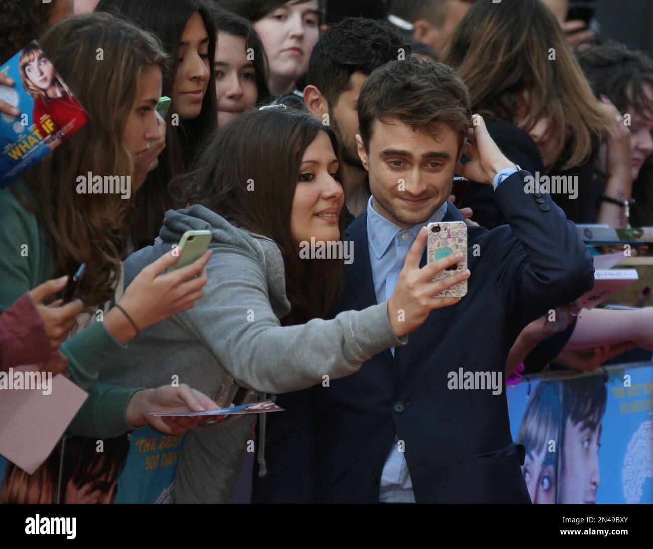 British actor Daniel Radcliffe poses for photographs with fans as he ...