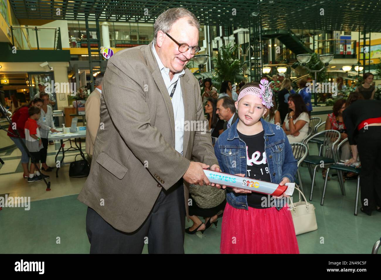 IMAGE DISTRIBUTED FOR SIEMENS - Dr. Jim Whitlock is seen passing the ...