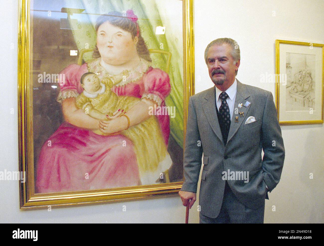 Colombian artist and sculptor, Fernando Botero, smiles at photographers ...