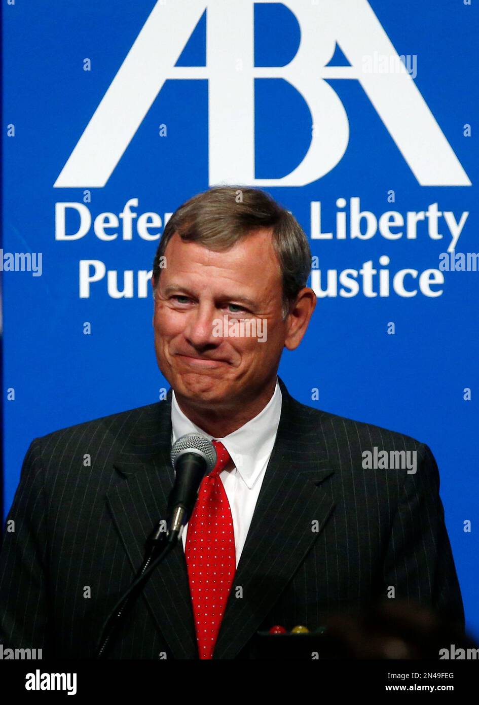 Supreme Court Chief Justice John Roberts smiles as he ends his speech ...