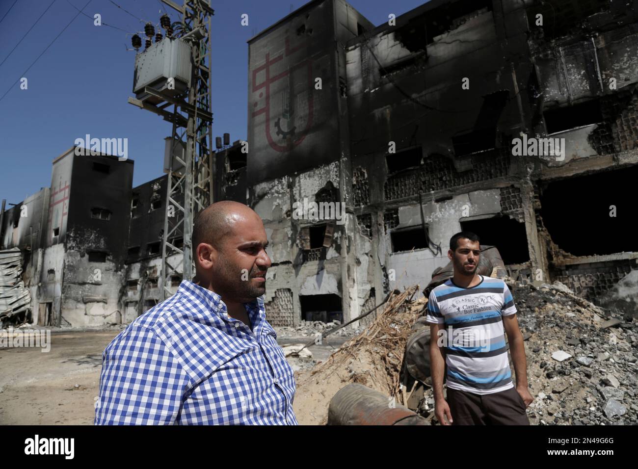 In this Sunday, Aug. 10, 2014 photo, Ibrahim al-Telbani, left, and ...
