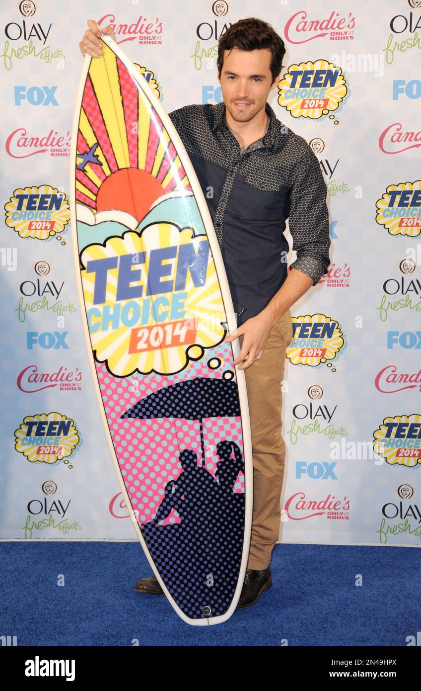 Ian Harding poses in the press room at the Teen Choice Awards at the ...