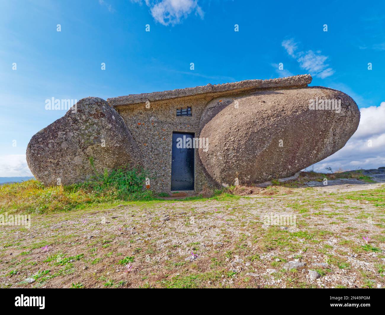 Boulder house or Casa do Penedo, a house built between huge rocks on top of a mountain in Fafe ...