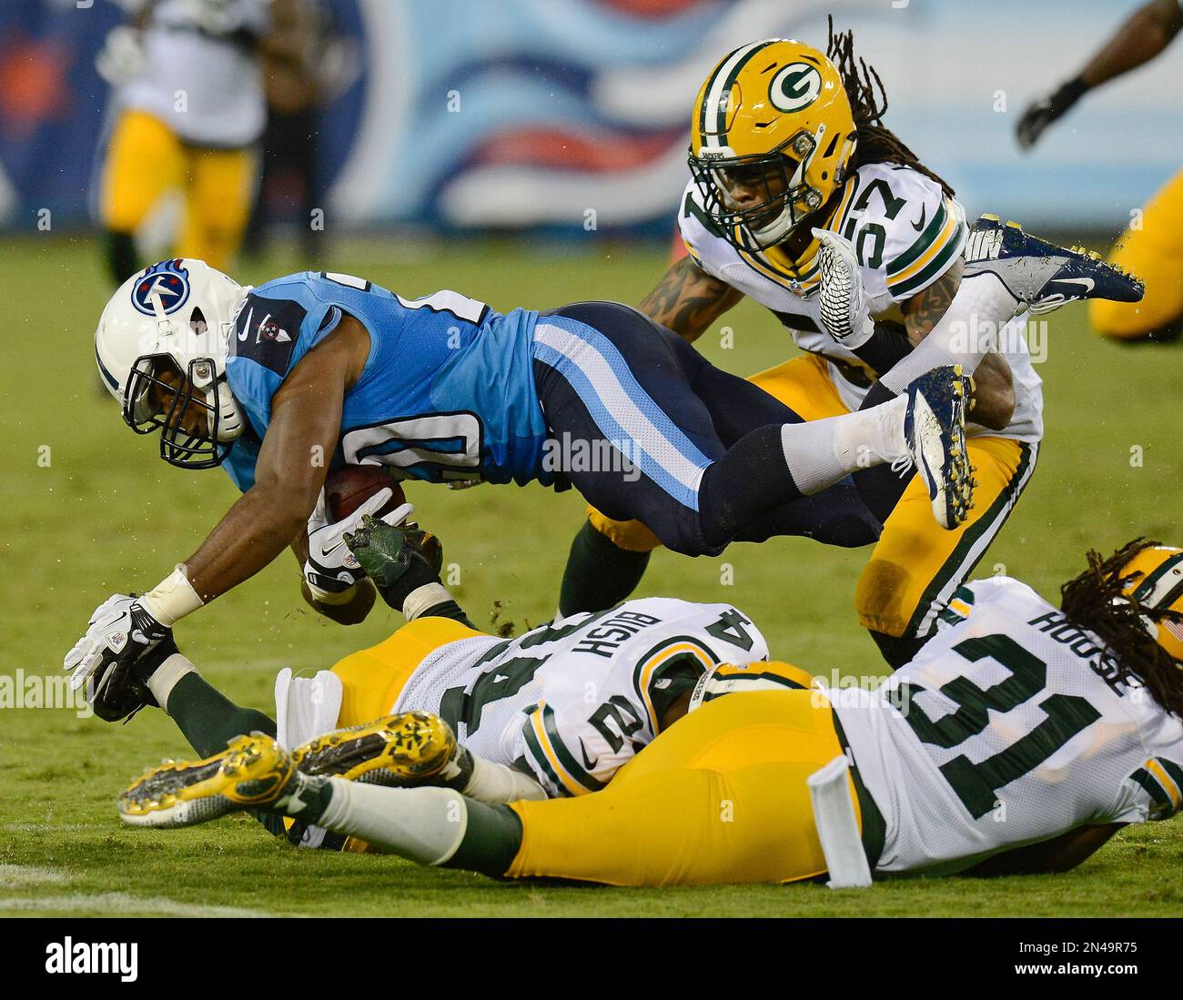 Tennessee Titans running back Bishop Sankey (20) is brought down by ...