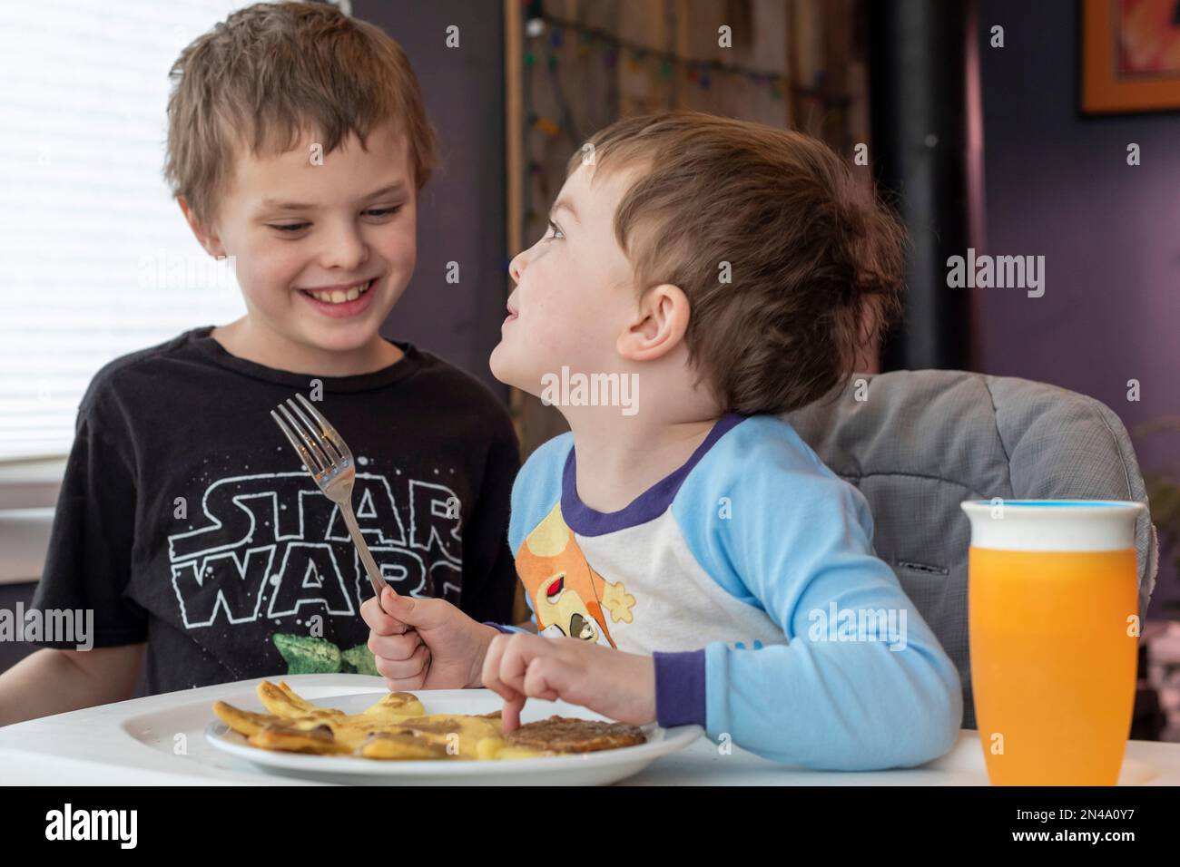 Denver, Colorado - Hendrix Hjermstad, 4, guards his breakfast while his ...